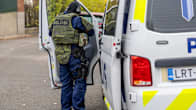 A police officer wearing protective gear in front of the US Embassy in Helsinki.