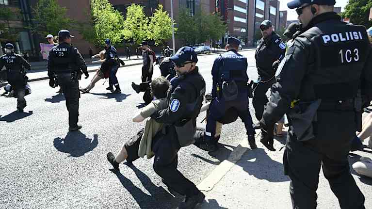 Climate activist group accuses police of violently breaking up Helsinki ...
