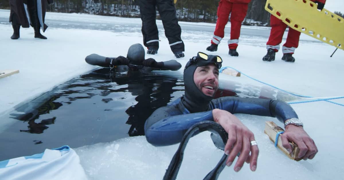 Watch: Diver breaks ice swimming world record in Finnish lake | Yle